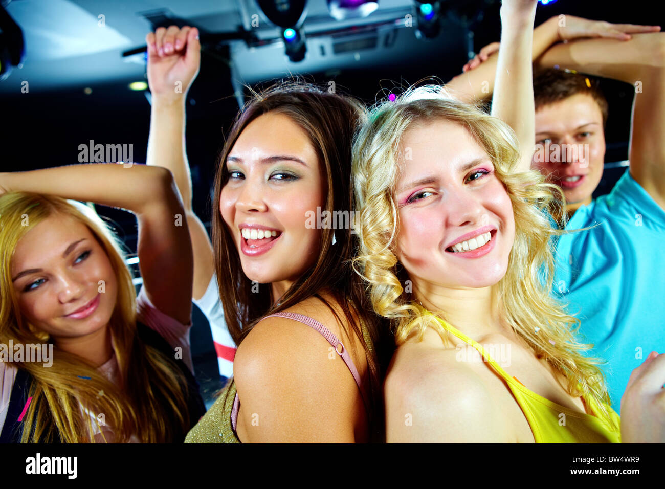 Two glamorous girls dancing in night club and having fun Stock Photo ...
