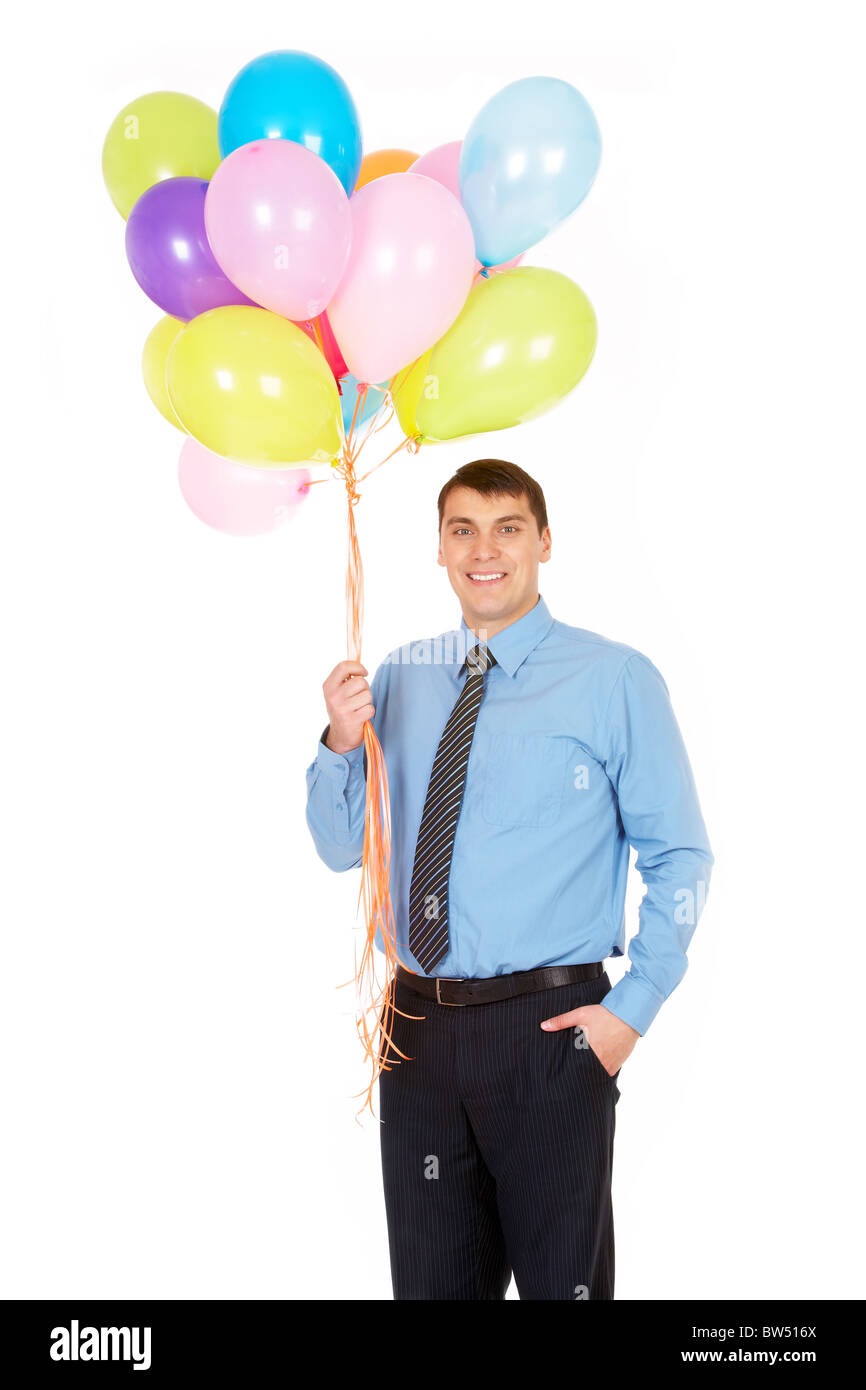 Image of successful businessman holding colorful balloons and looking ...