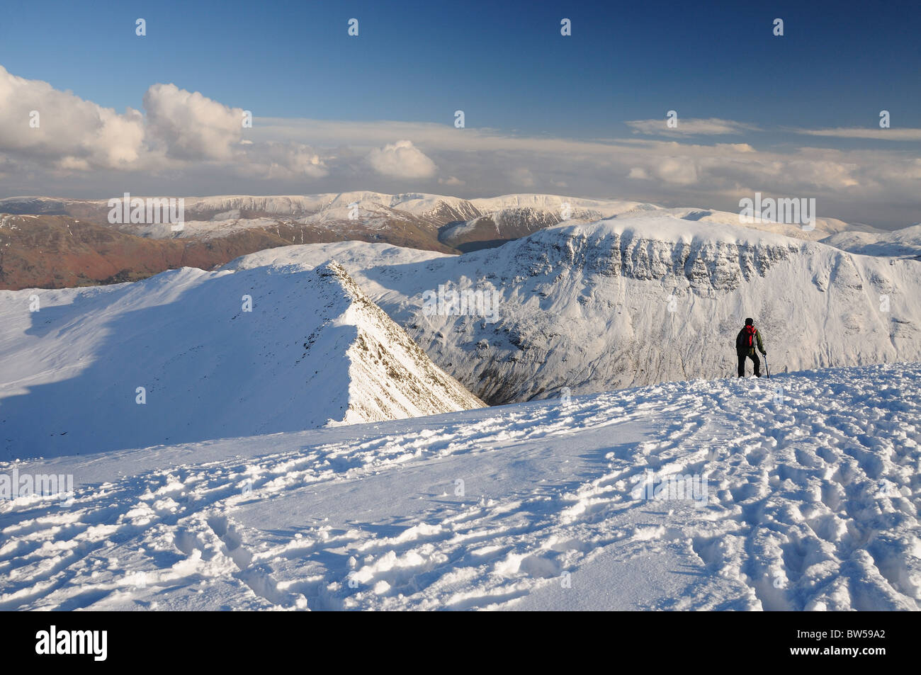 Walker on Helvellyn looking out over Striding Edge towards St Sunday ...