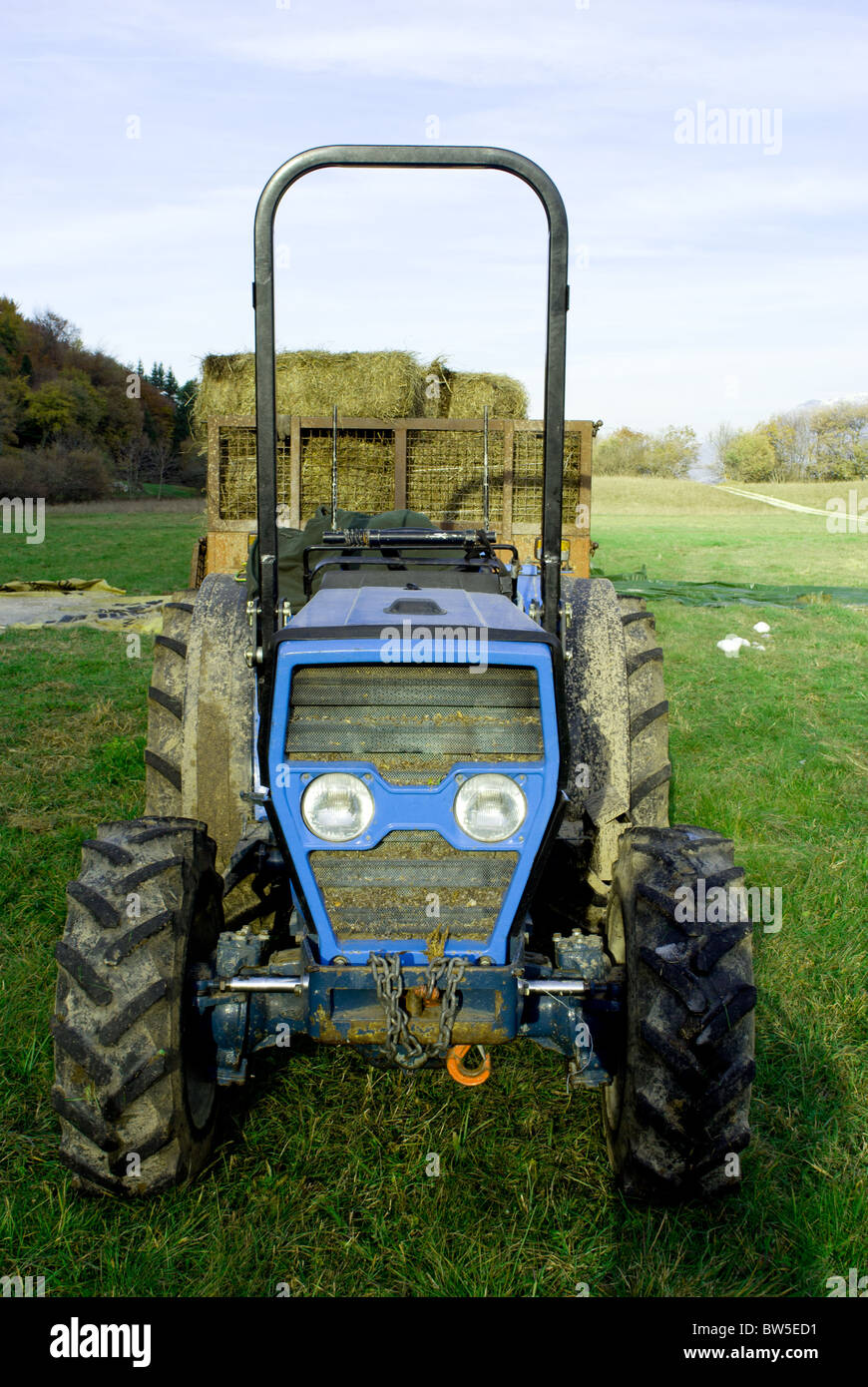 lawn tractor the load of hay Stock Photo - Alamy