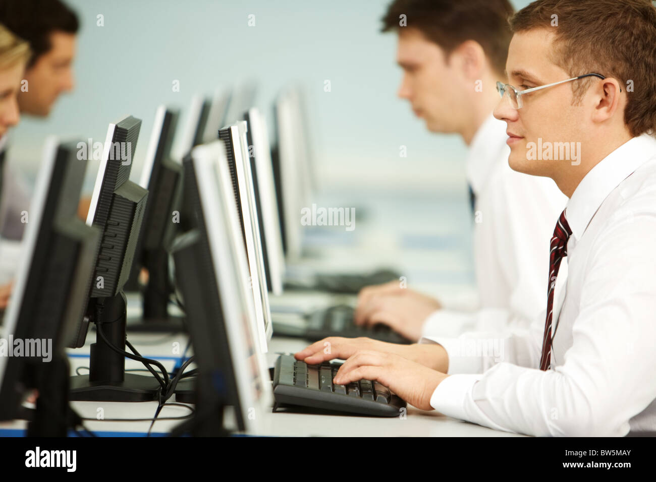 Clever businessmen typing in line at workplace Stock Photo - Alamy