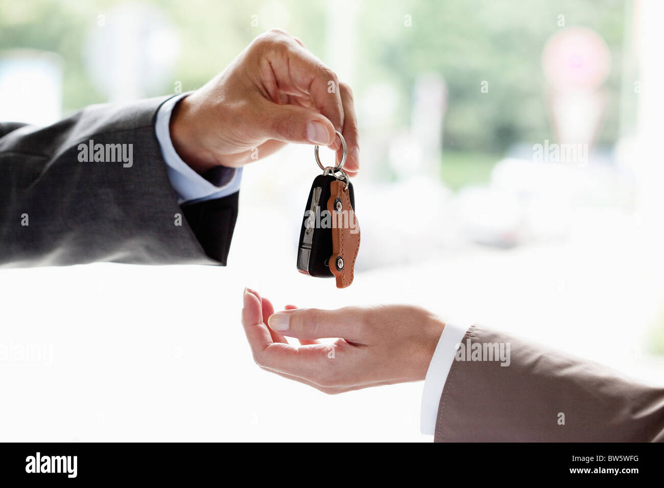 Handing over key Stock Photo - Alamy
