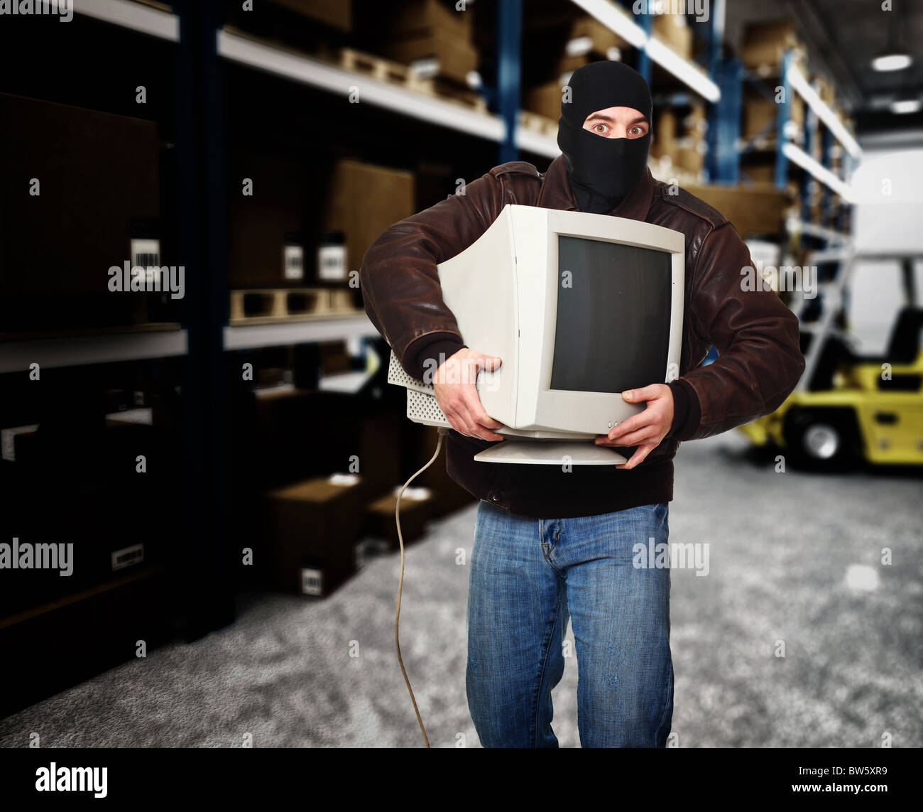 thief in action classic warehouse and forklift Stock Photo - Alamy