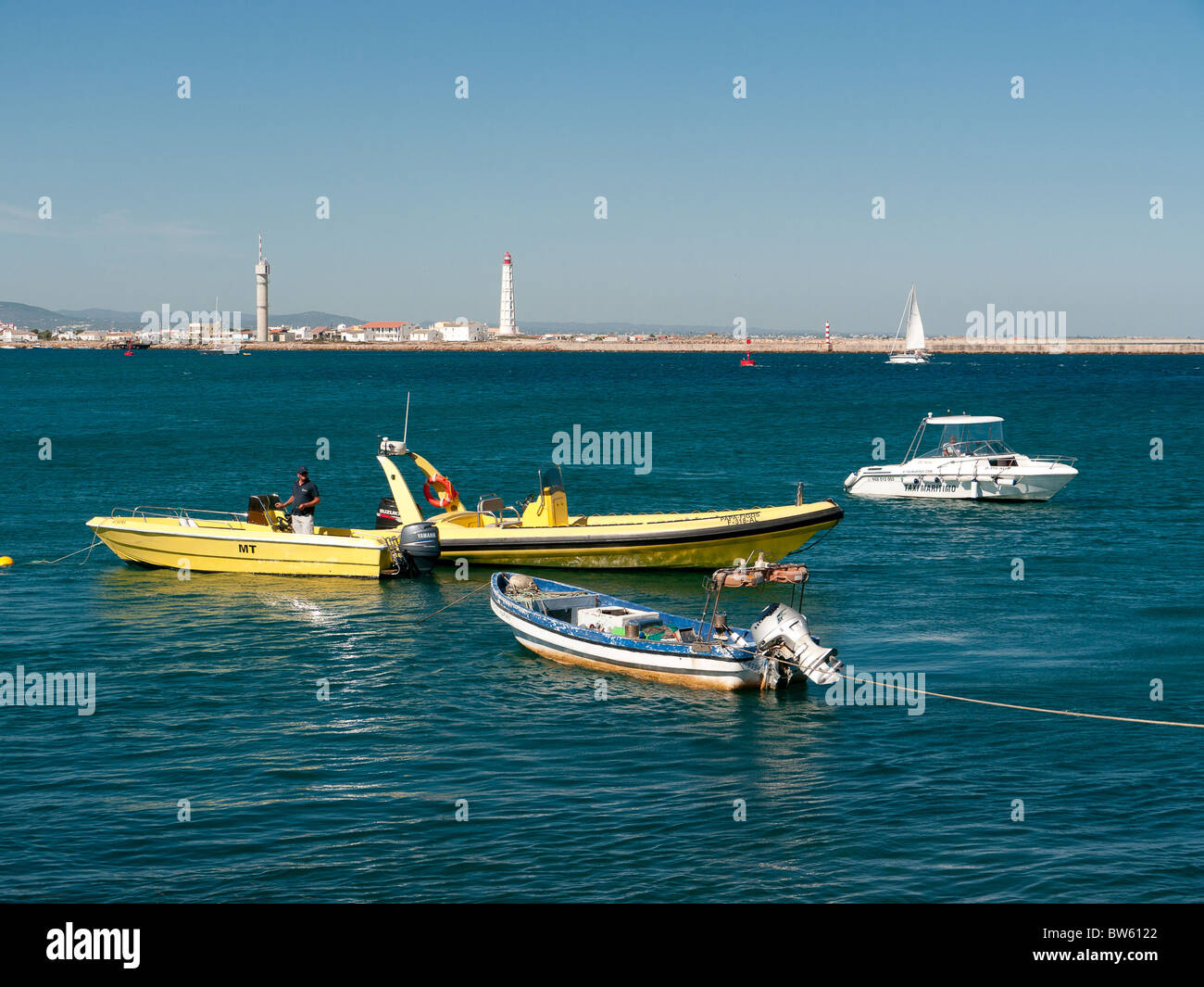 Motor and Pleasure Boats in the bay and harbour of Faro, Algarve ...
