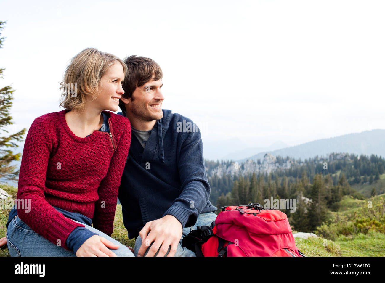 Couple watching landscape on mountain Stock Photo - Alamy
