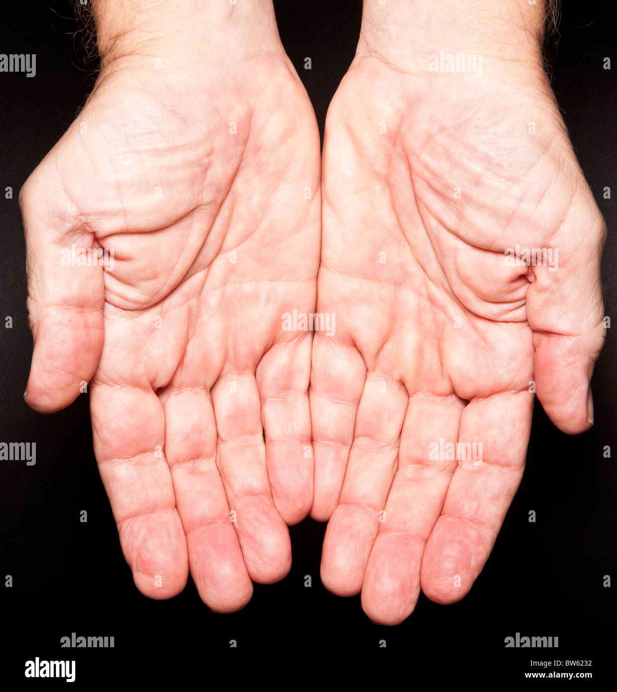 older man's bare hands on black bkg Stock Photo - Alamy