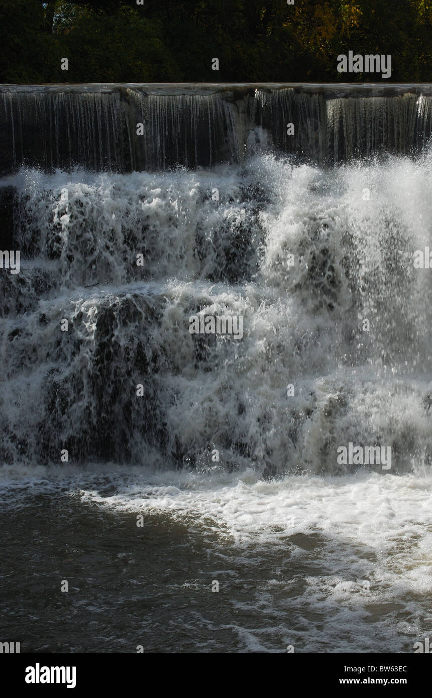 Water falls over rocks ledge Stock Photo - Alamy