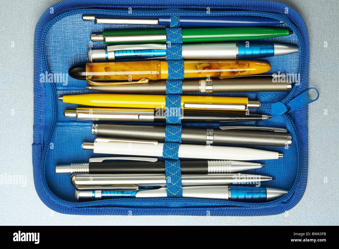 Collection of different pens placed in a blue pen-box Stock Photo - Alamy