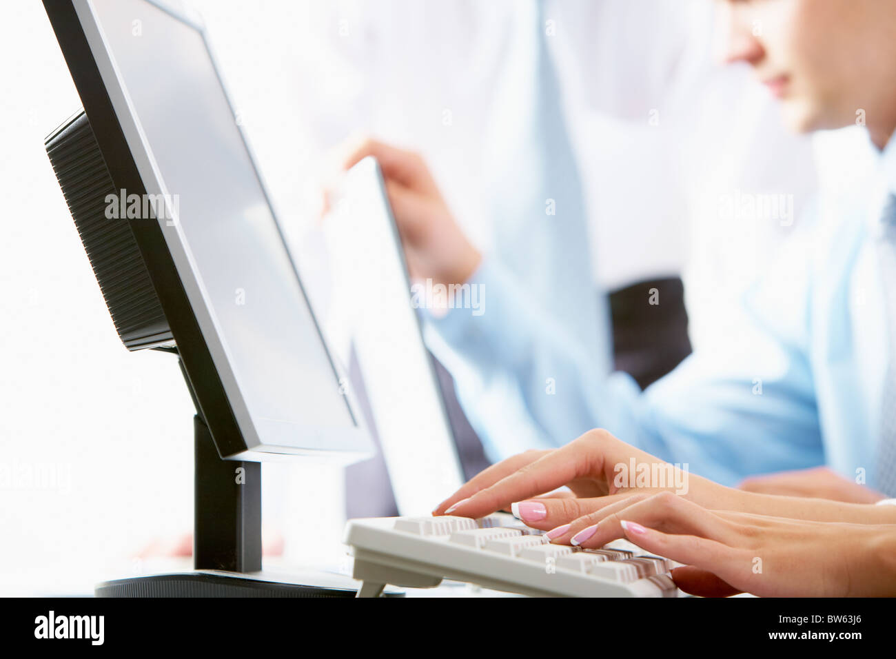 Close-up of female hands typing a letter at workplace Stock Photo - Alamy