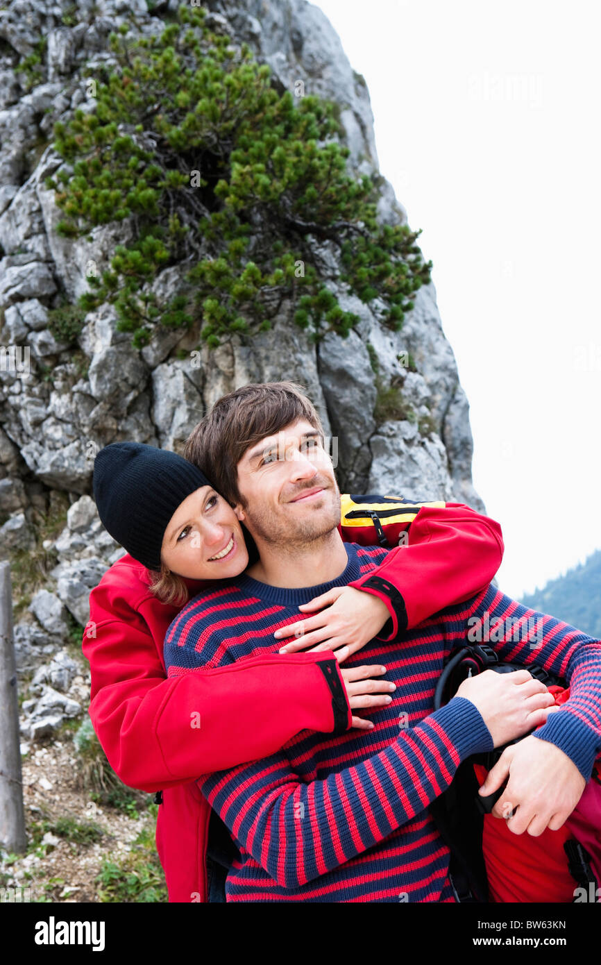 Woman hugging man from behind Stock Photo - Alamy