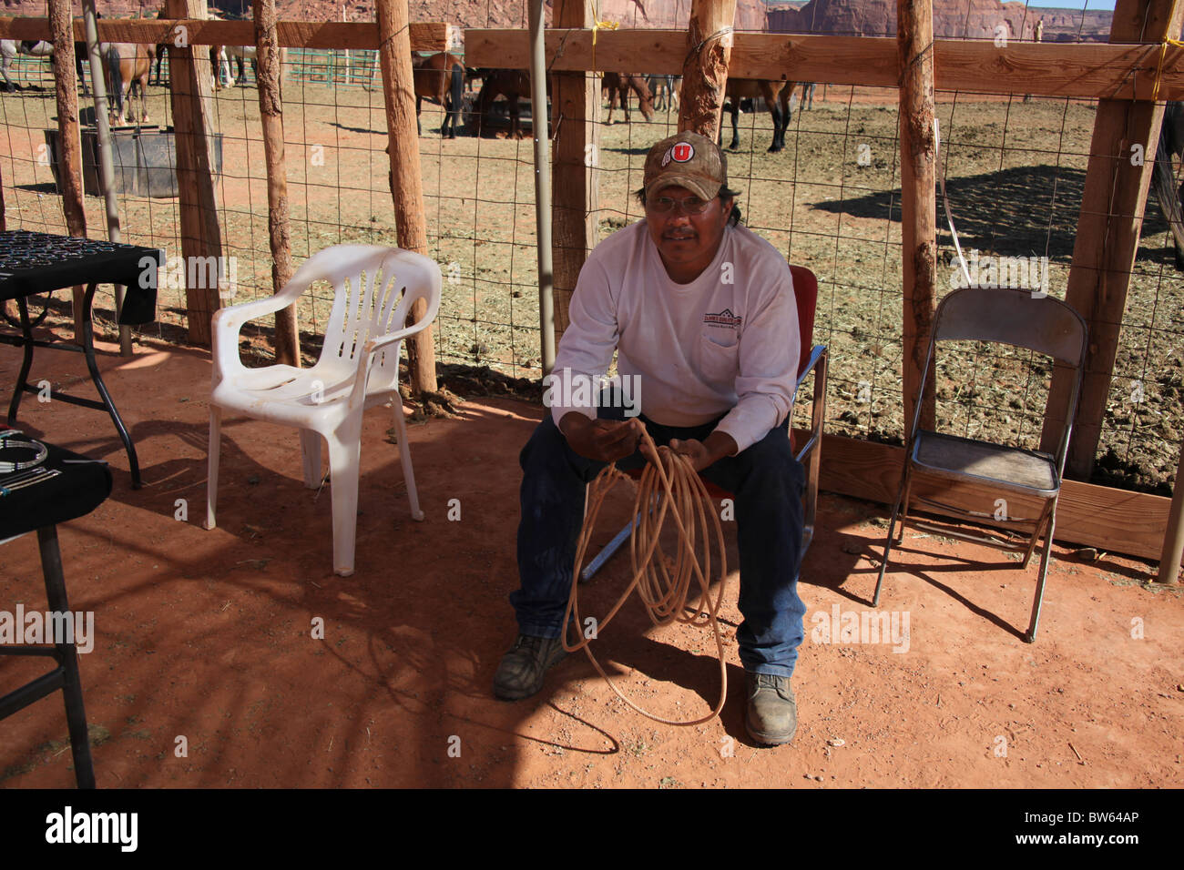 Native American Navajo rancher holding lasso in Monument Valley ...