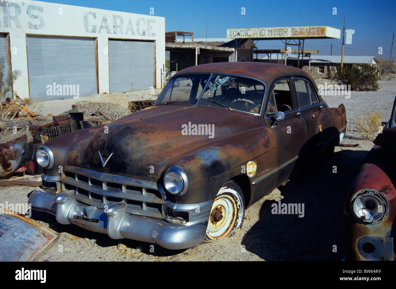 A sandblasted and rusted 1955 Cadillac at an abandoned garage in the ...