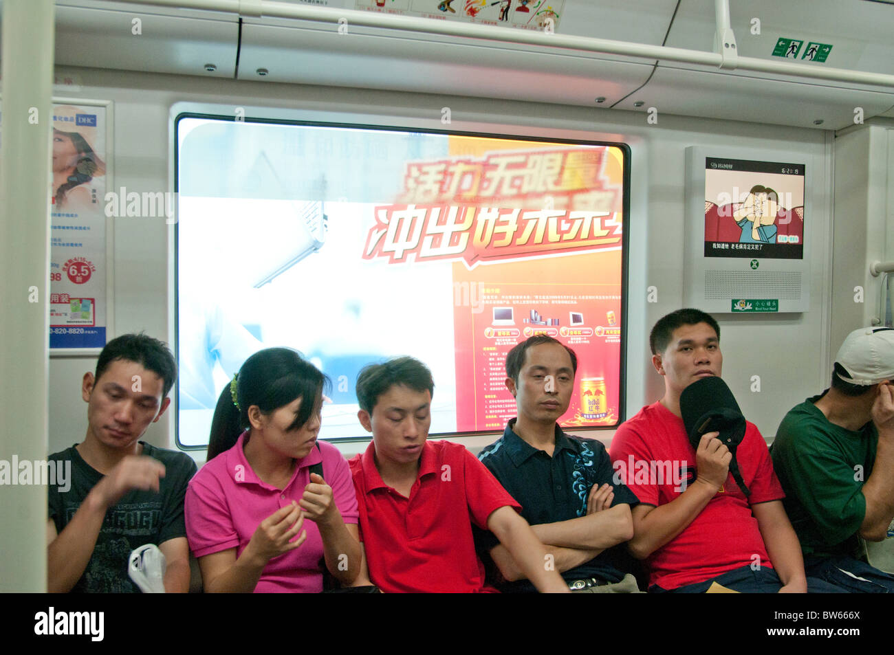 CHINA. COMMUTERS IN SUBWAY TRAIN IN GUANGZHOU, GUANGDONG PROVINCE Stock ...