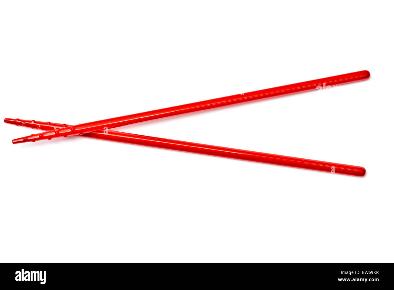 Red chopsticks isolated on white background Stock Photo - Alamy