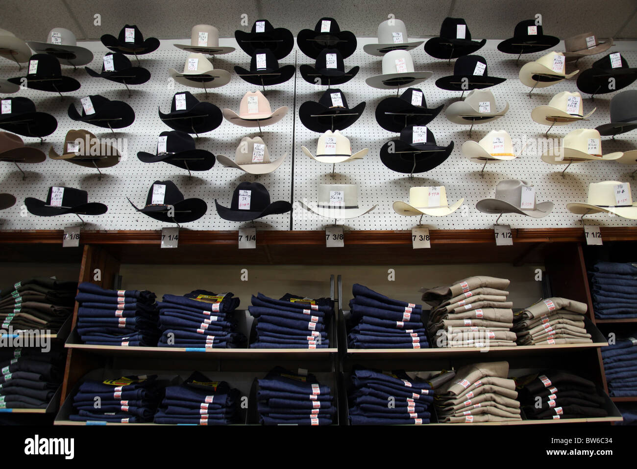 Inside of a store selling Cowboy hats and denim jeans Stock Photo - Alamy