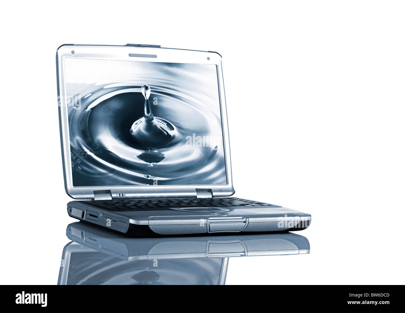 Open Laptop on a desk with reflection with a image of a water drop on ...