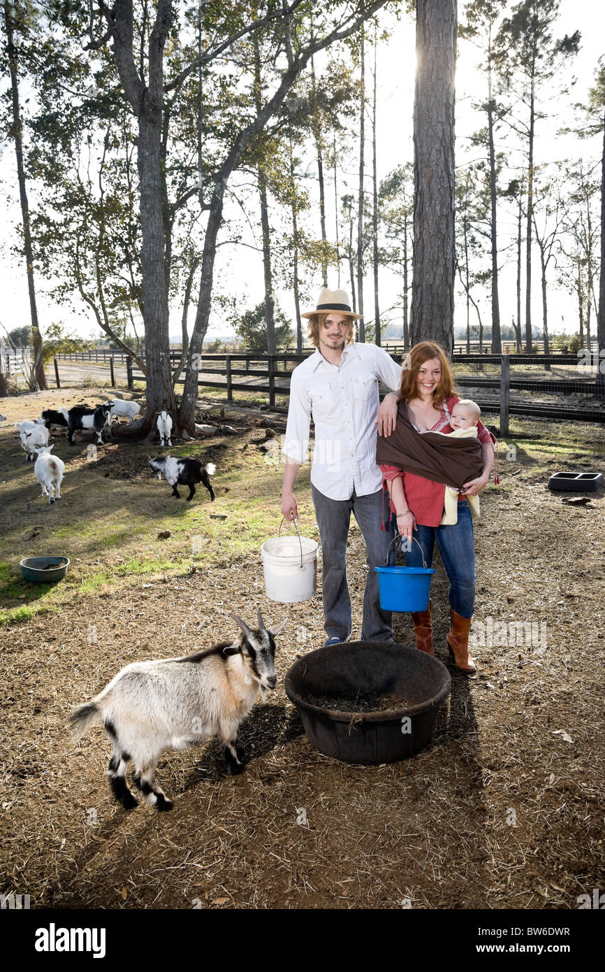 Woman feeding young goat outdoors hi-res stock photography and images ...