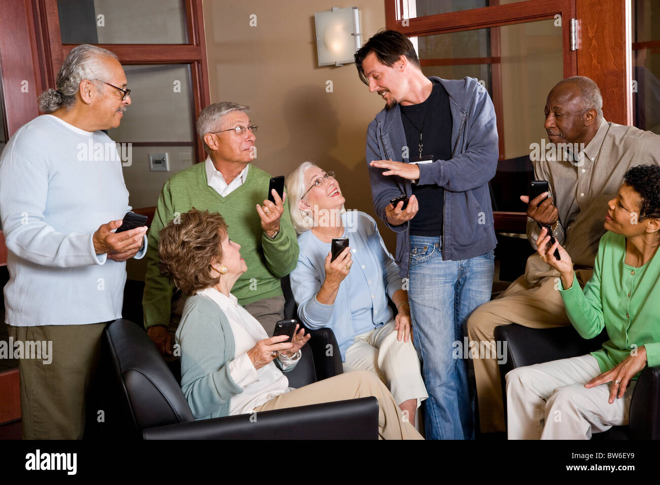 Multi-ethnic seniors learning to use modern technology Stock Photo - Alamy
