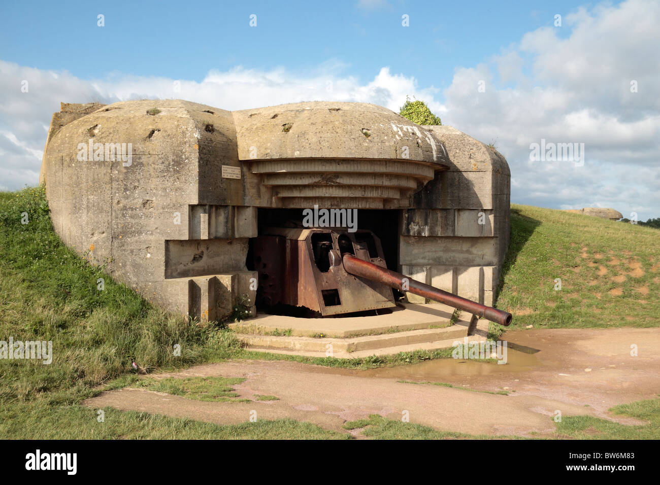 A 150mm gun in one of the four casements of the Longues-sur-Mer Battery ...