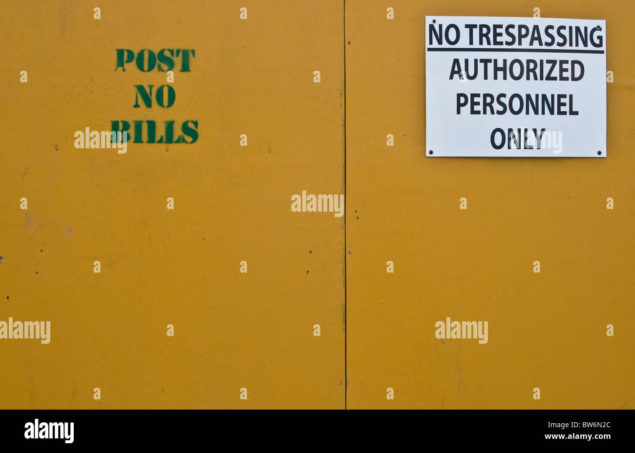 Post no bills sign at construction site. No trespassing authorized ...
