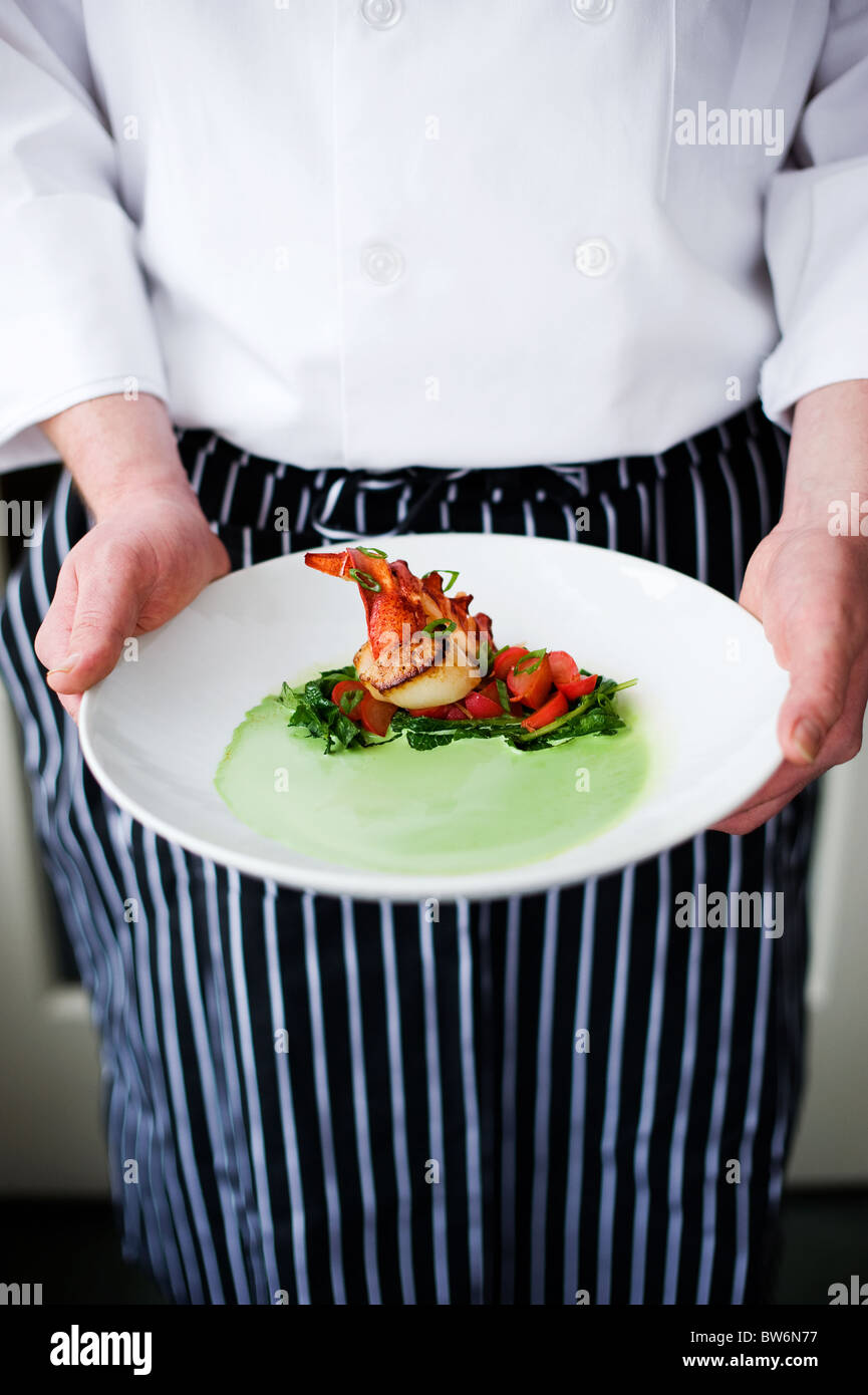 chef holding plate of food Stock Photo - Alamy
