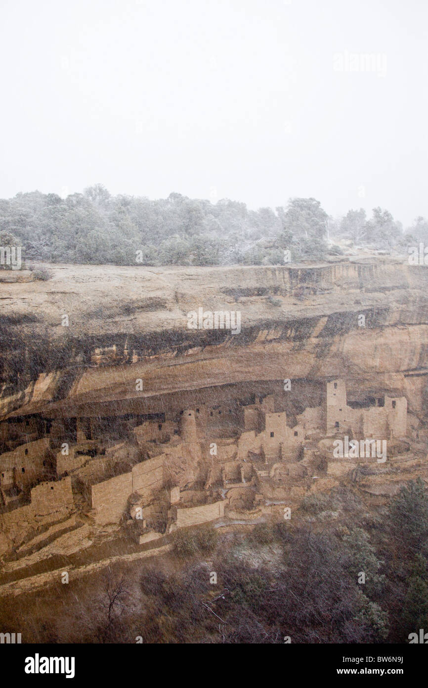 View of Cliff Palace cliff dwellings in a winter snow storm in Mesa ...
