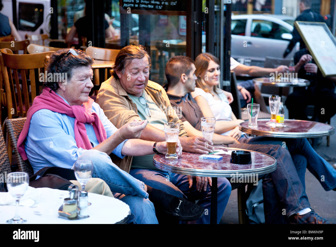 Diverse group of people eating outside hi-res stock photography and ...