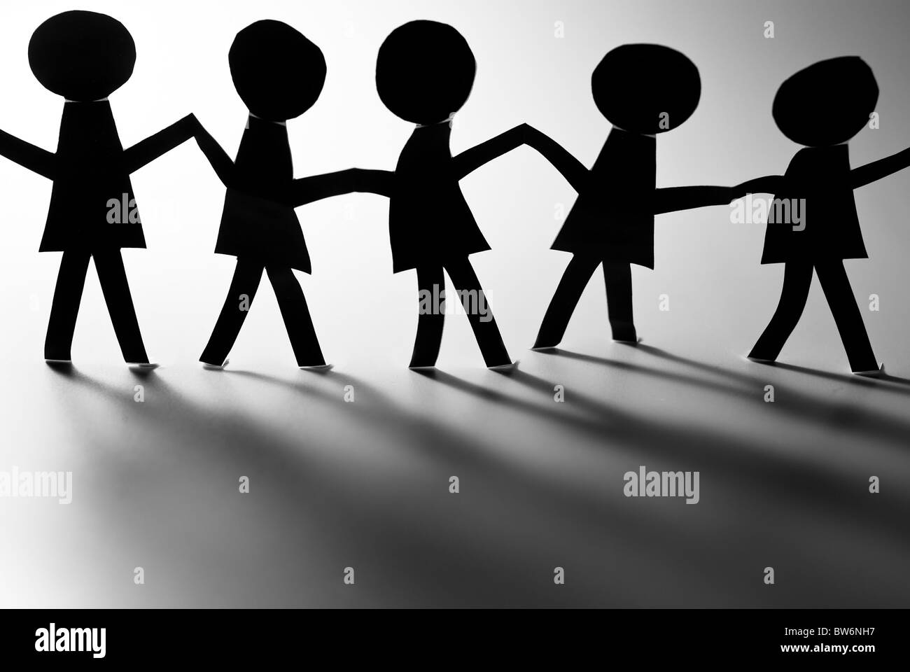 human chain with shadows Stock Photo - Alamy