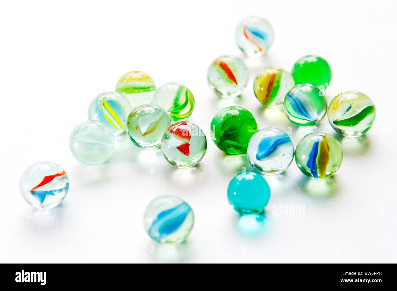 Brightly colored marbles in different shades on bright white Stock ...