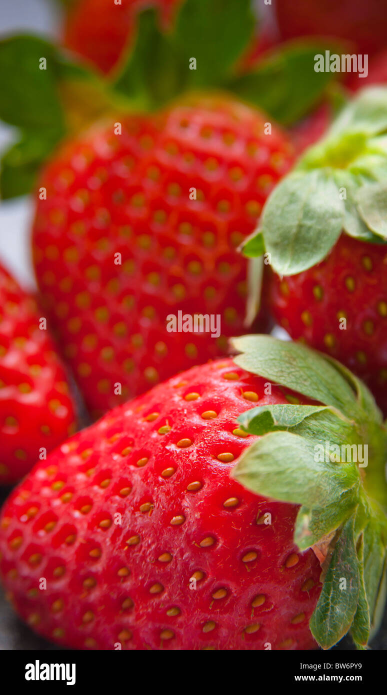 Group of bright red shiny strawberries hi-res stock photography and ...