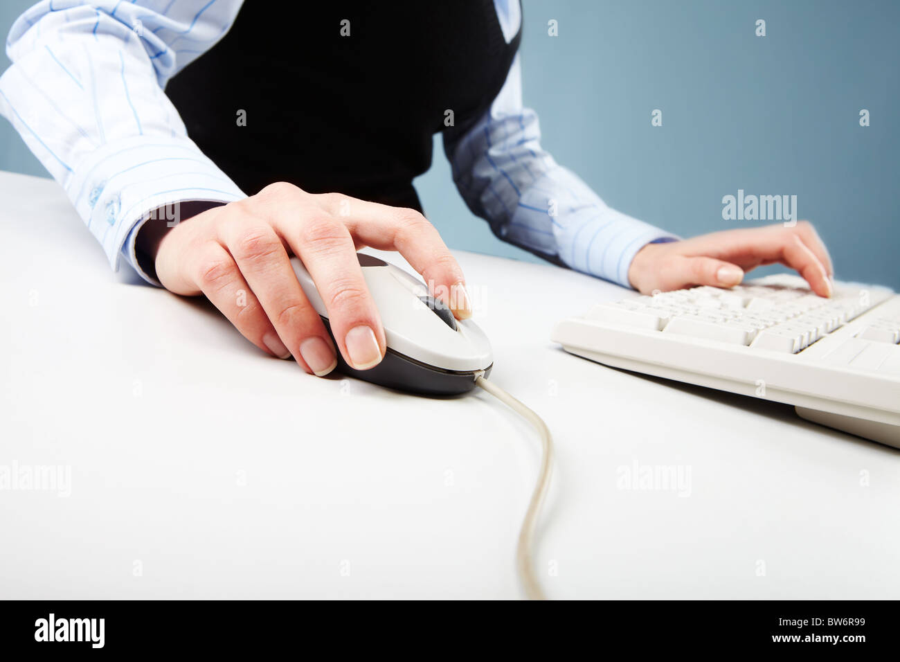 Close-up of human hand on white mouse during computer work Stock Photo ...