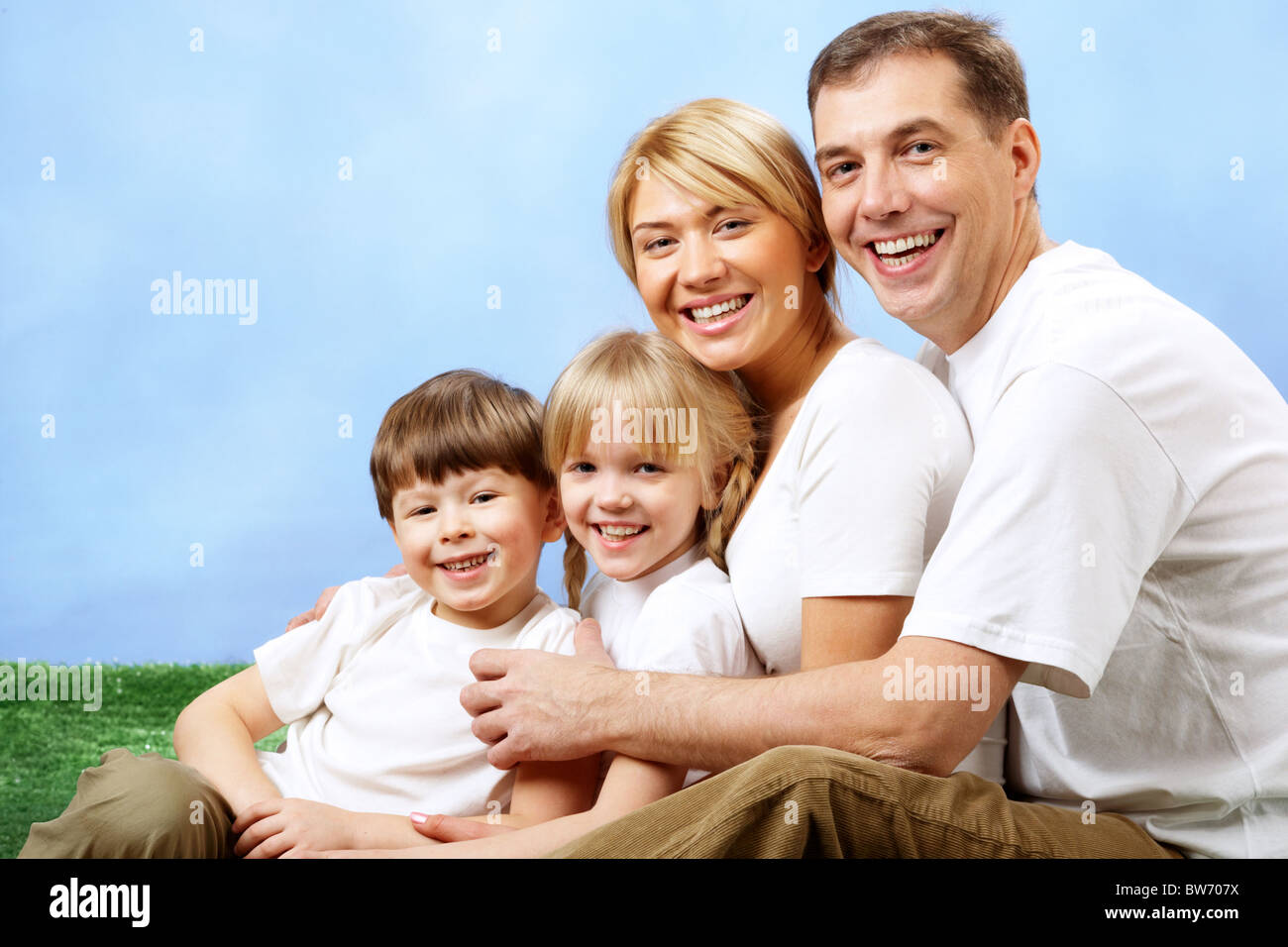 Portrait of joyful family looking at camera and laughing Stock Photo ...