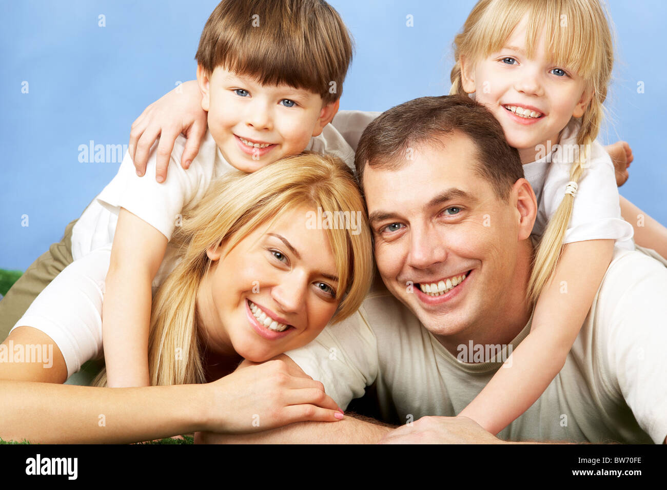 Photo of family members smiling at camera Stock Photo - Alamy