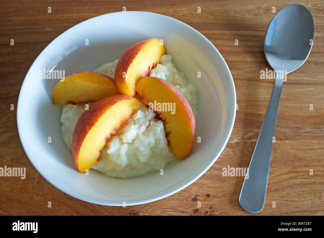 Creamed rice pudding with apricot slices hi-res stock photography and ...