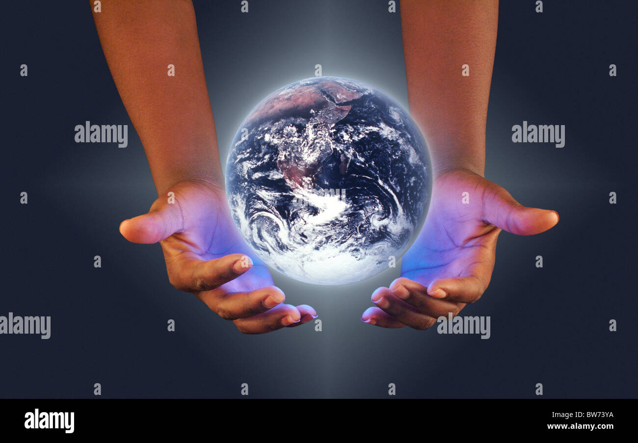 Two hands holding the planet earth hi-res stock photography and images ...