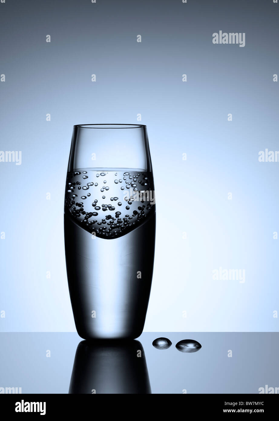 Bullet liqueur glass containing effervescent liquid Stock Photo - Alamy