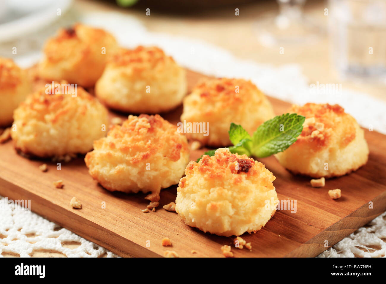 Freshly baked coconut macaroons on a cutting board Stock Photo - Alamy