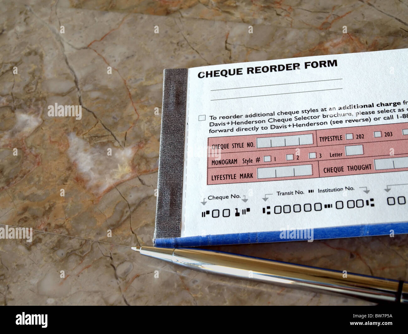 Blank check reorder form and pen on the table Stock Photo - Alamy