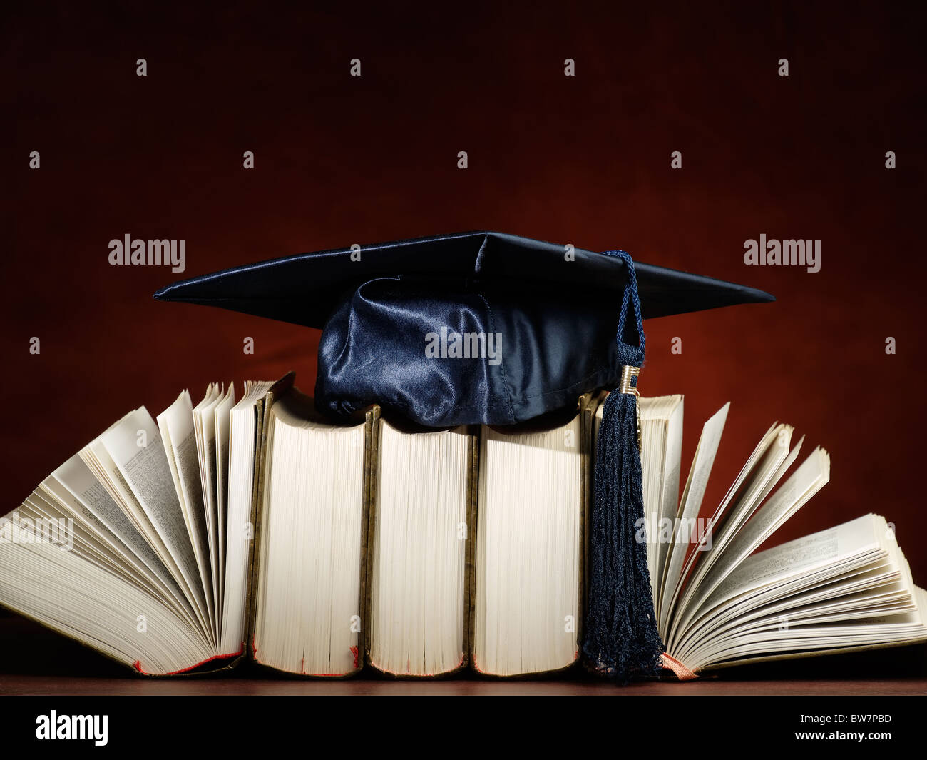 graduation cap on top of the books, for graduation,knowledge or ...