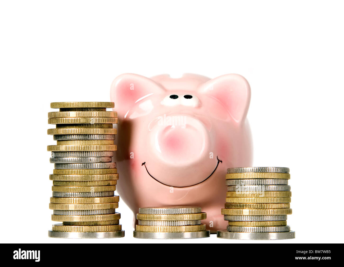 Saving pig is smiling and standing near money Stock Photo - Alamy