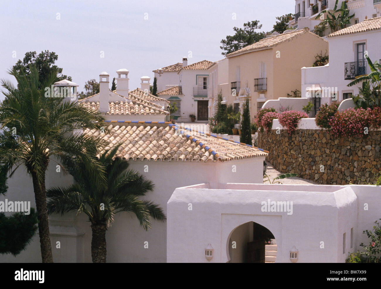 Pantiled roofs on traditional houses in small Spanish hillside village ...