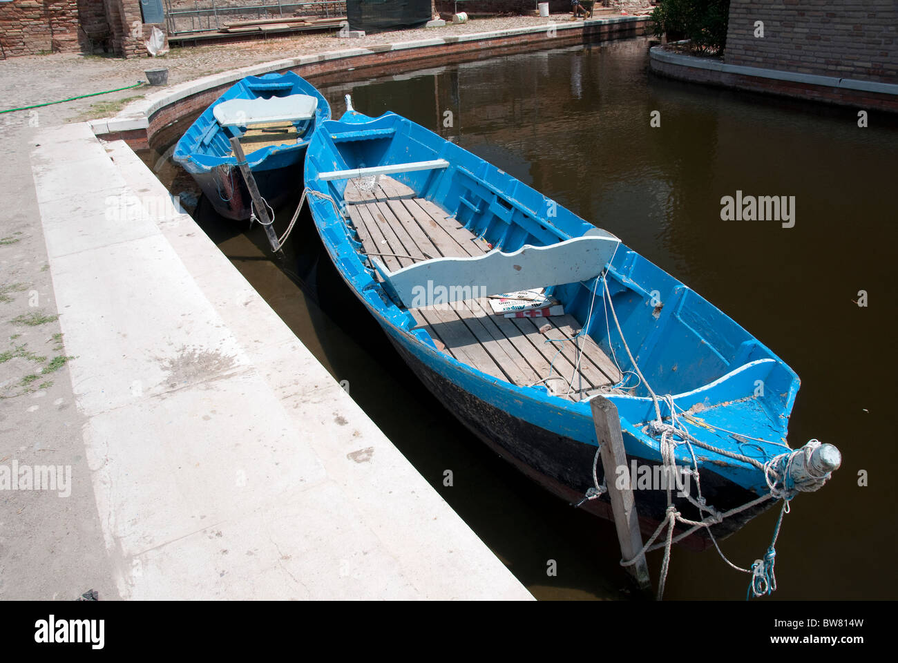 Two blue boats moored in Comacchio, Emilia Romagna, Italy Stock Photo ...