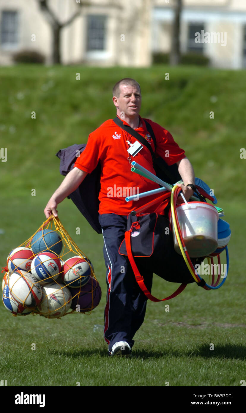 Coaches and volunteers in action Stock Photo - Alamy