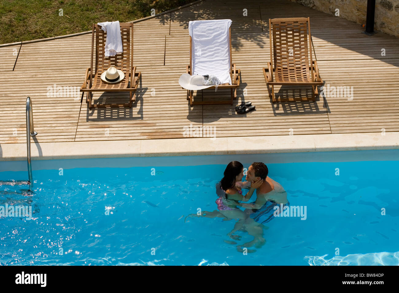Lovers in pool Stock Photo - Alamy