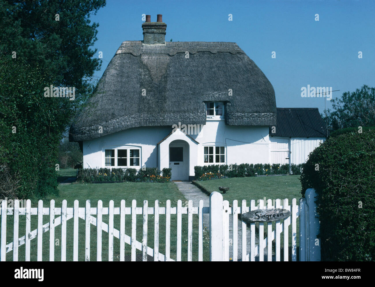 Thatched Cottage White Picket Fence Stock Photos & Thatched Cottage ...
