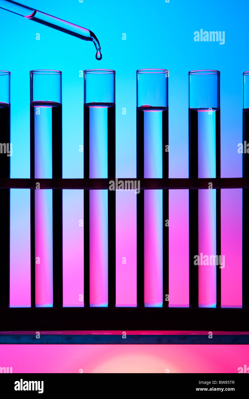 Row of test tubes and eye dropper Stock Photo - Alamy