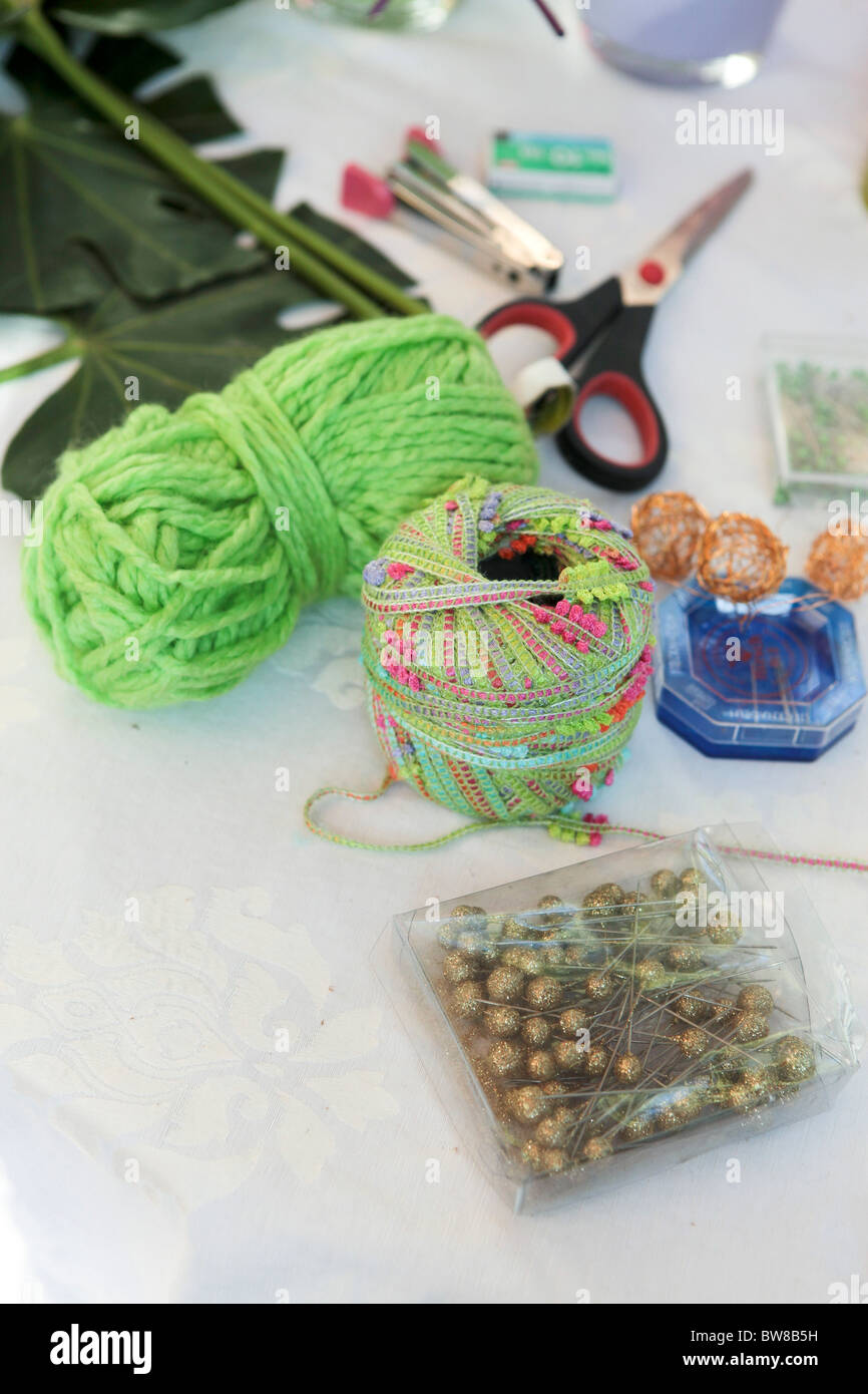 Handwork equipment wool, scissors and beads Stock Photo - Alamy