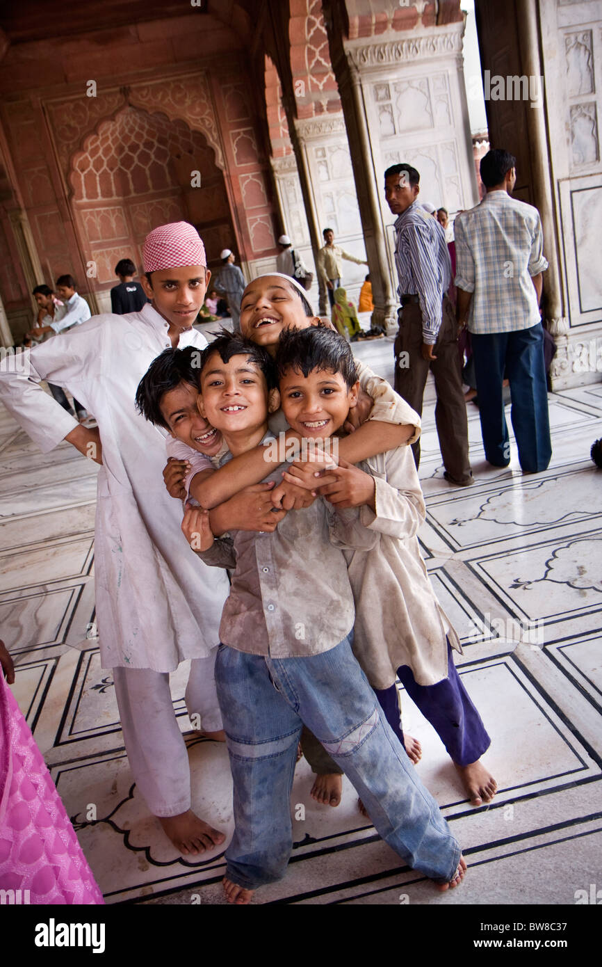 Indian boys laughing at the Jama Masjid Mosque, Delhi, India Stock ...