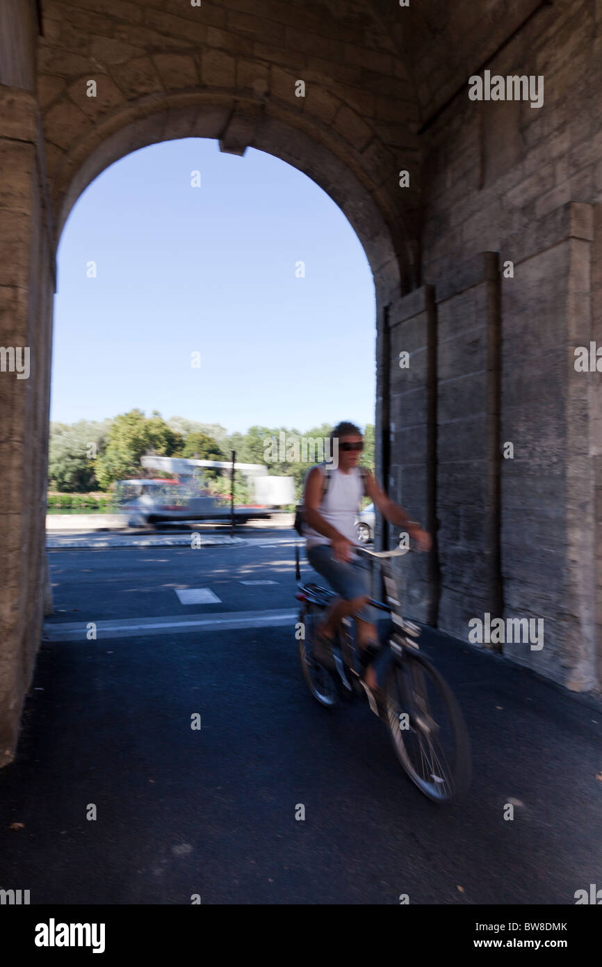 Woman cycling through gates hi-res stock photography and images - Alamy