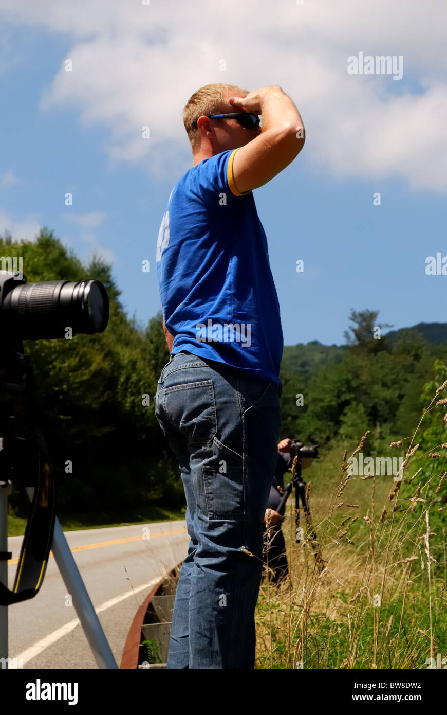 Photographer looks for the perfect shot Stock Photo - Alamy